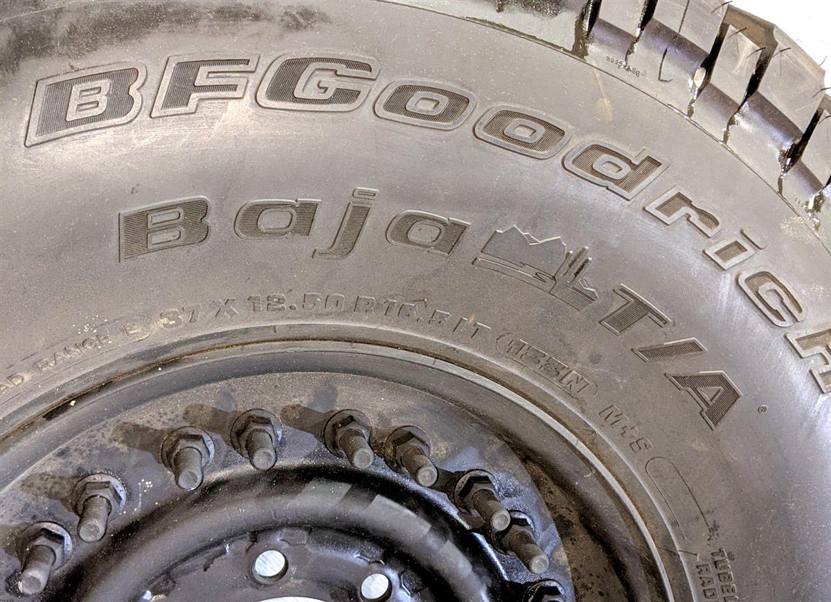 BF Goodrich Baja T/A 37X12.50R16.5LT Radial Tire Mounted on 24 Bolt Rim 100% Tread HMMWV